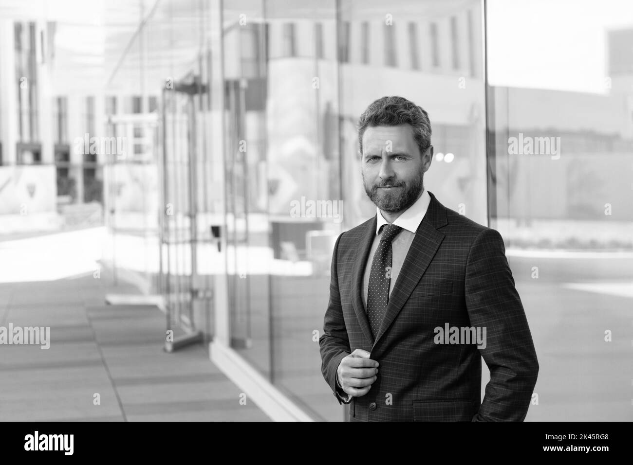 successful man boss in businesslike suit. manager outside the office ...