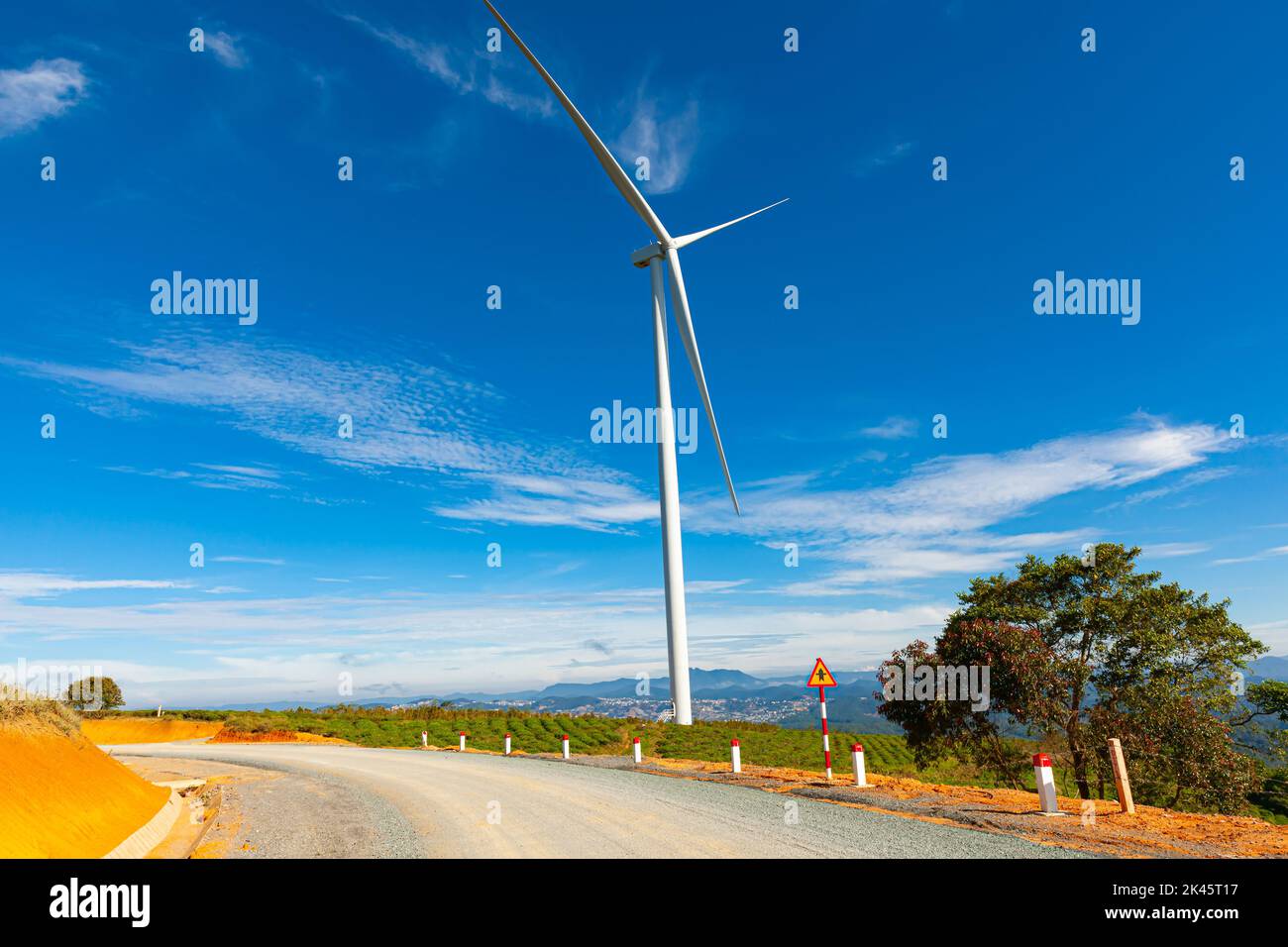 Renewable energy wind turbines windmill isolated on the beautiful blue ...