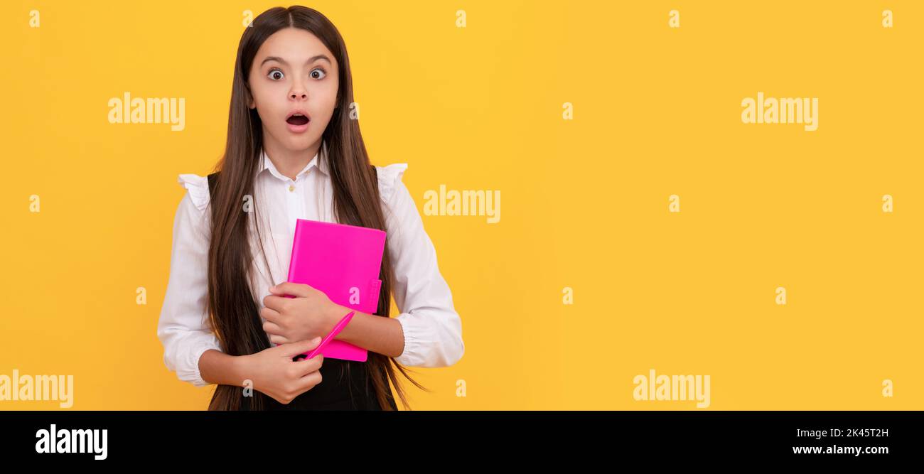 Education with fun learning. Shocked kid hold book yellow background ...