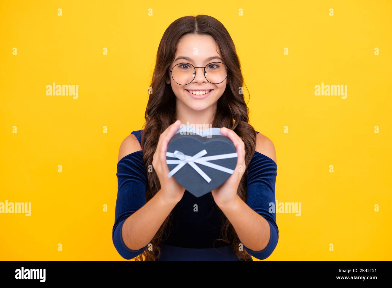 Teenager kid with present box. Teen girl giving birthday gift. Present ...