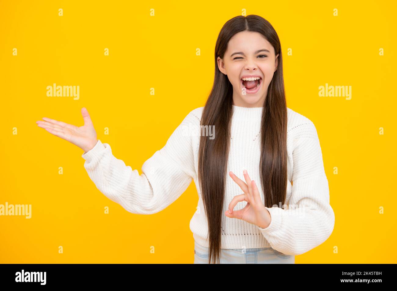 Look at advert. Teenager child points aside shows blank copy space for ...