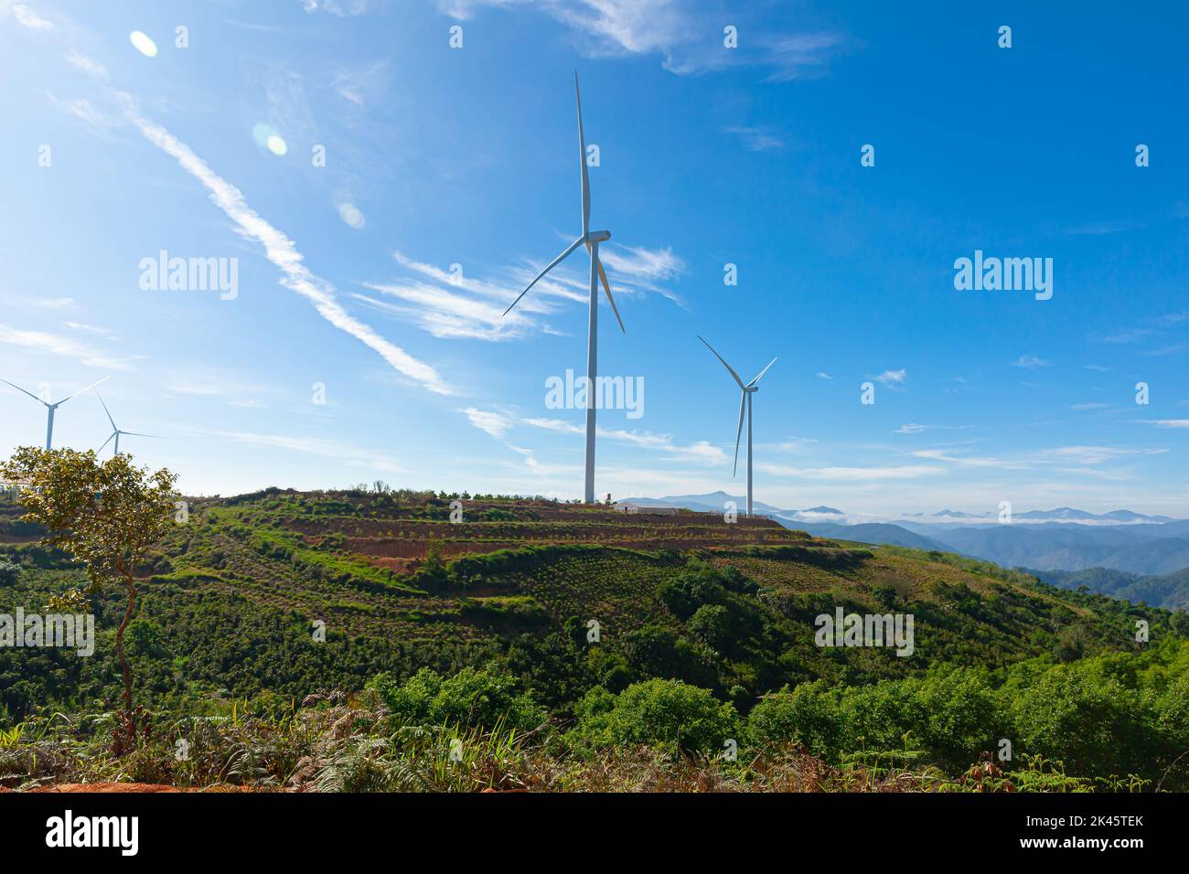 Renewable energy wind turbines windmill isolated on the beautiful blue ...