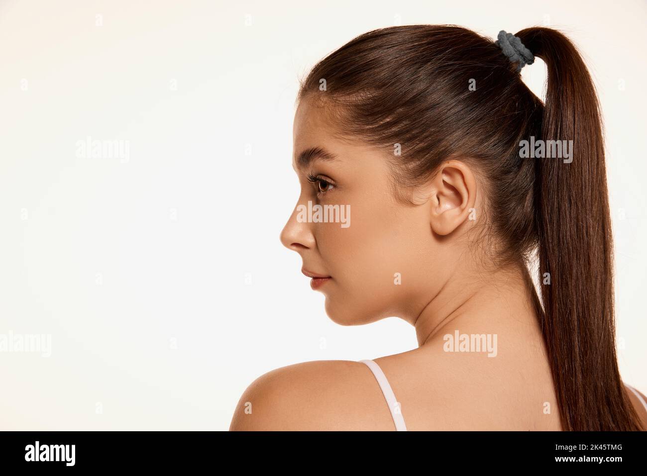 Portrait of young beautiful woman with clear spotless skin and long ...