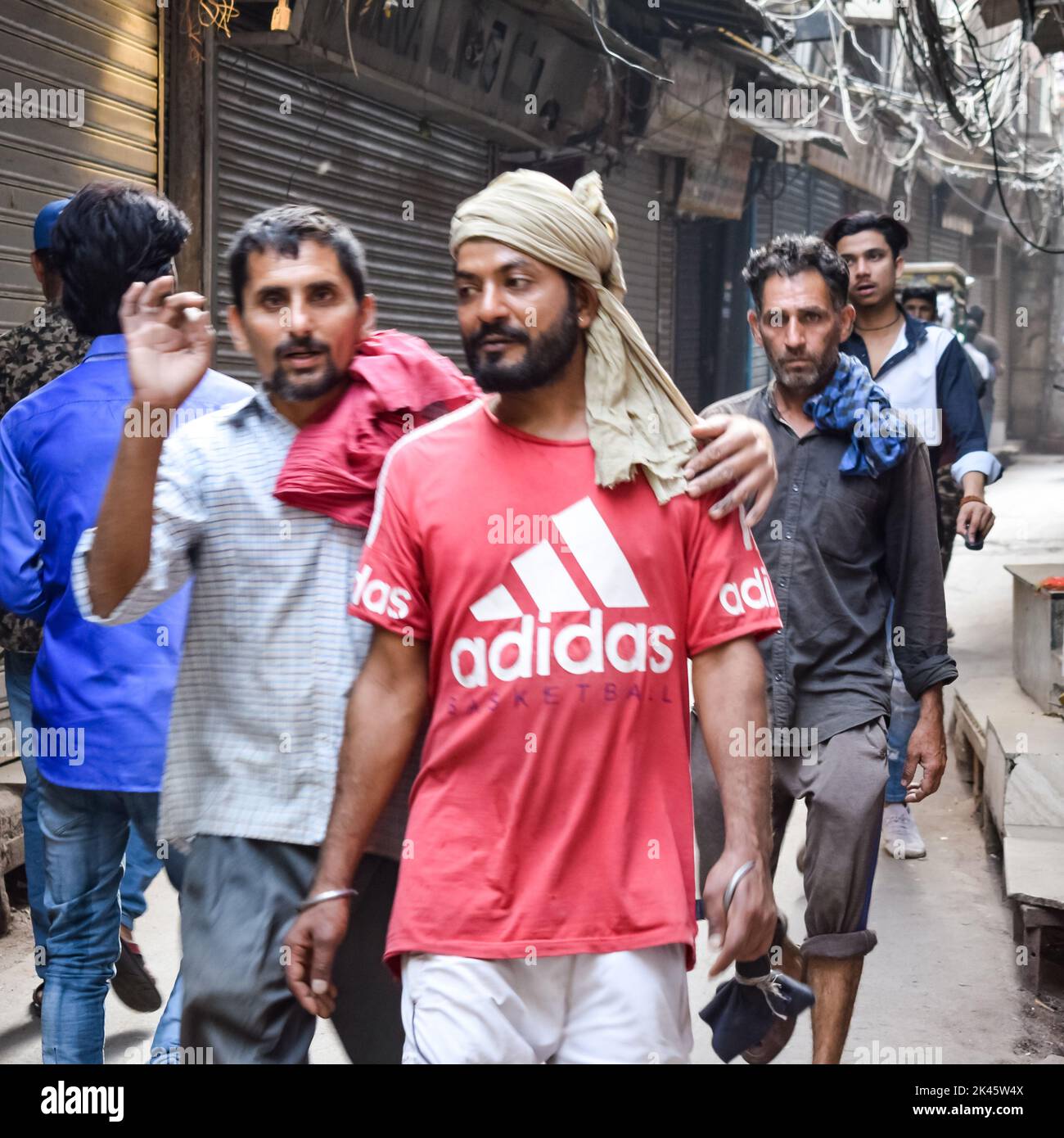 Old Delhi, India, April 15, 2022 - Unidentified group of men walking ...