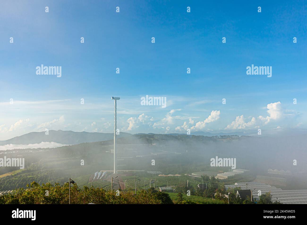 Renewable energy wind turbines windmill isolated on the beautiful blue ...