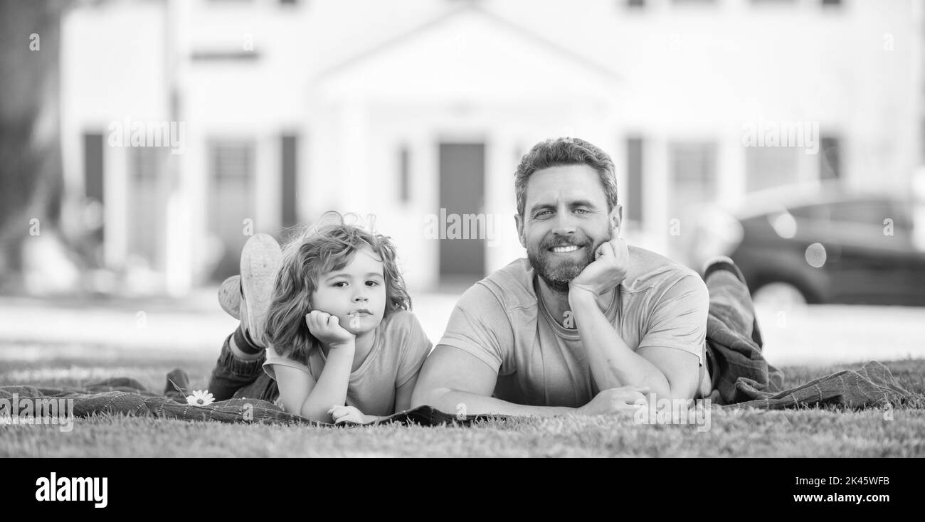 fathers day. friendly father and son having fun in park. family value ...