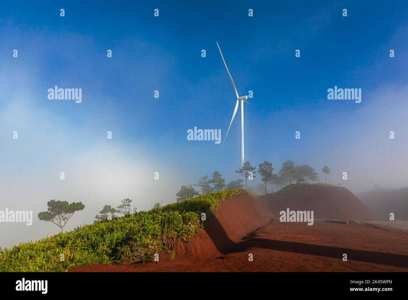 Renewable energy wind turbines windmill isolated on the beautiful blue ...