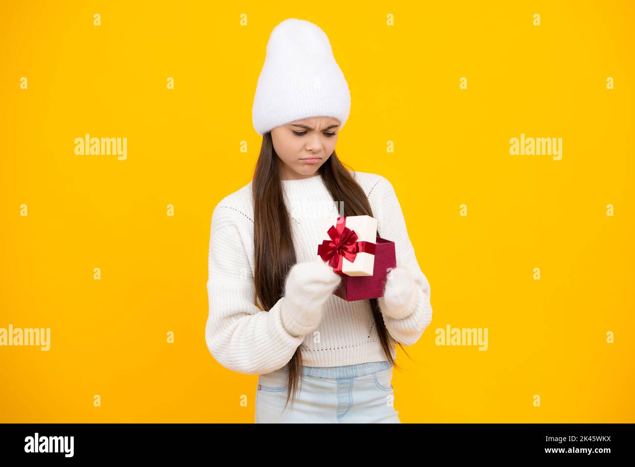 Emotional teenager child hold gift on birthday. Funny kid girl holding ...