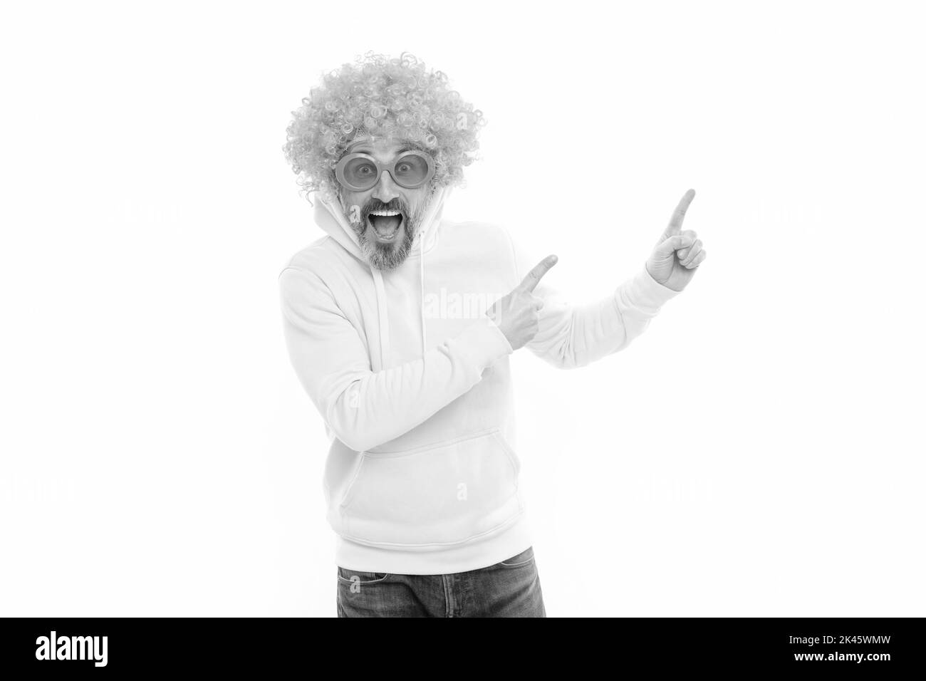 Crazy man in wig keep mouth open with surprise pointing index fingers ...