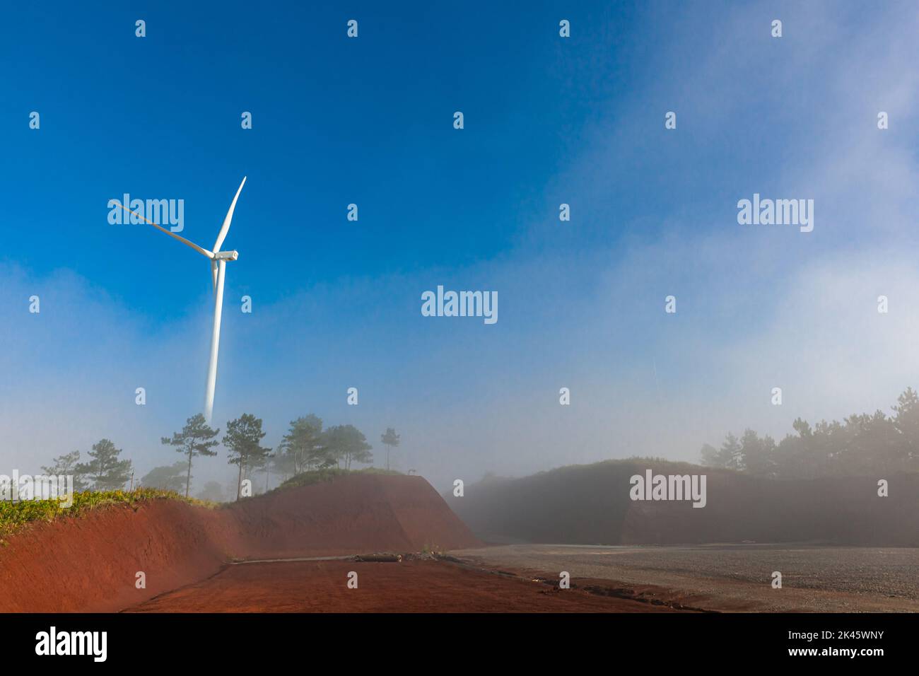 Renewable energy wind turbines windmill isolated on the beautiful blue ...