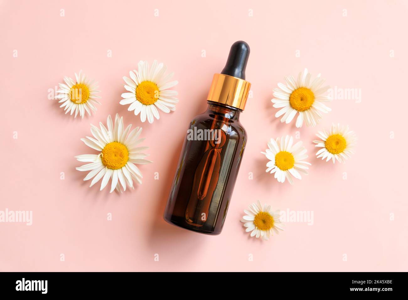 Serum in brown glass bottle with pipette and blooming medical ...