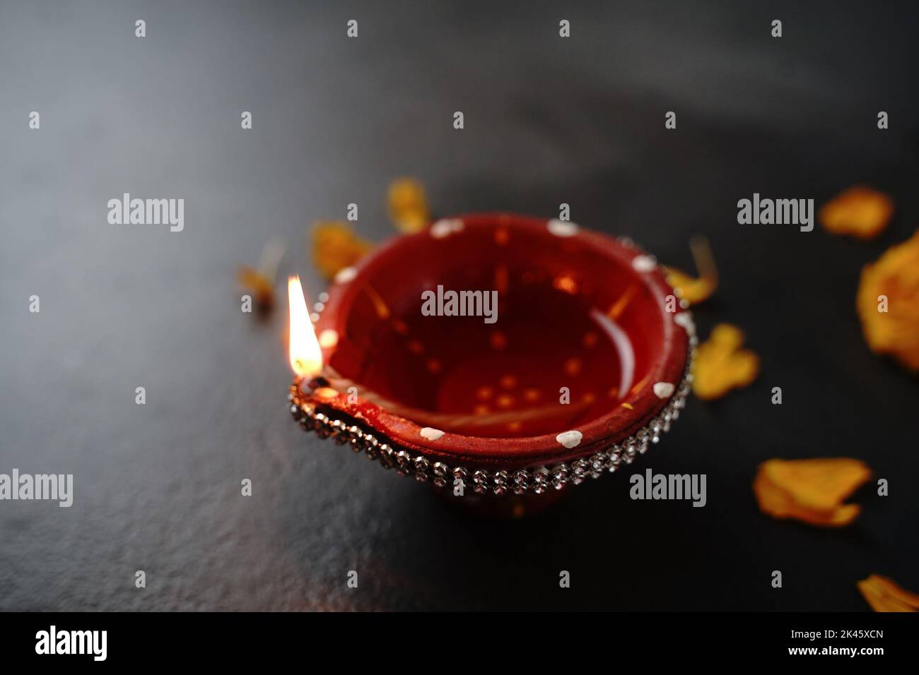 Happy Diwali background - Colorful Clay Diya lit during Deepavali ...