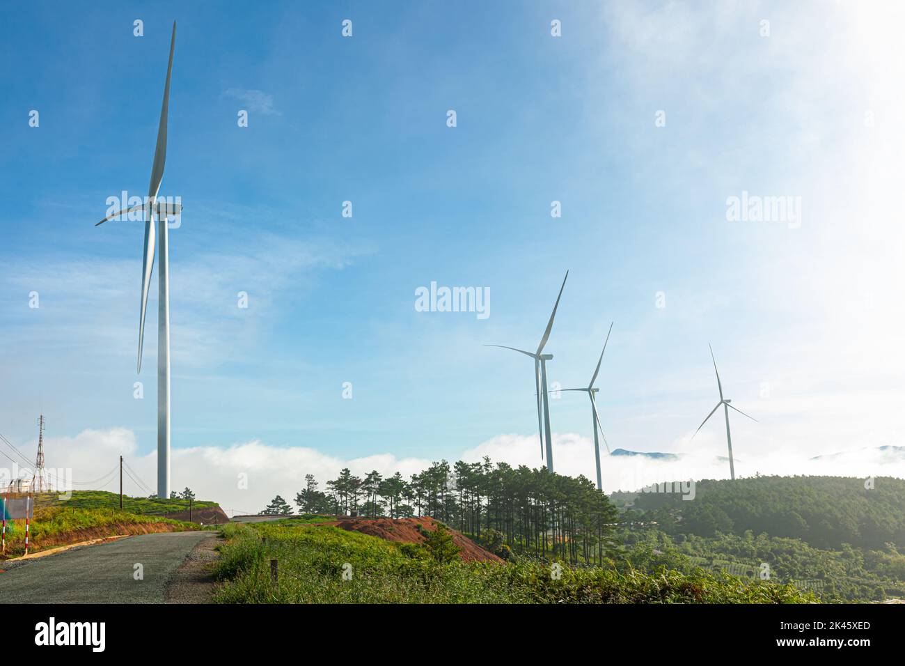 Renewable energy wind turbines windmill isolated on the beautiful blue ...