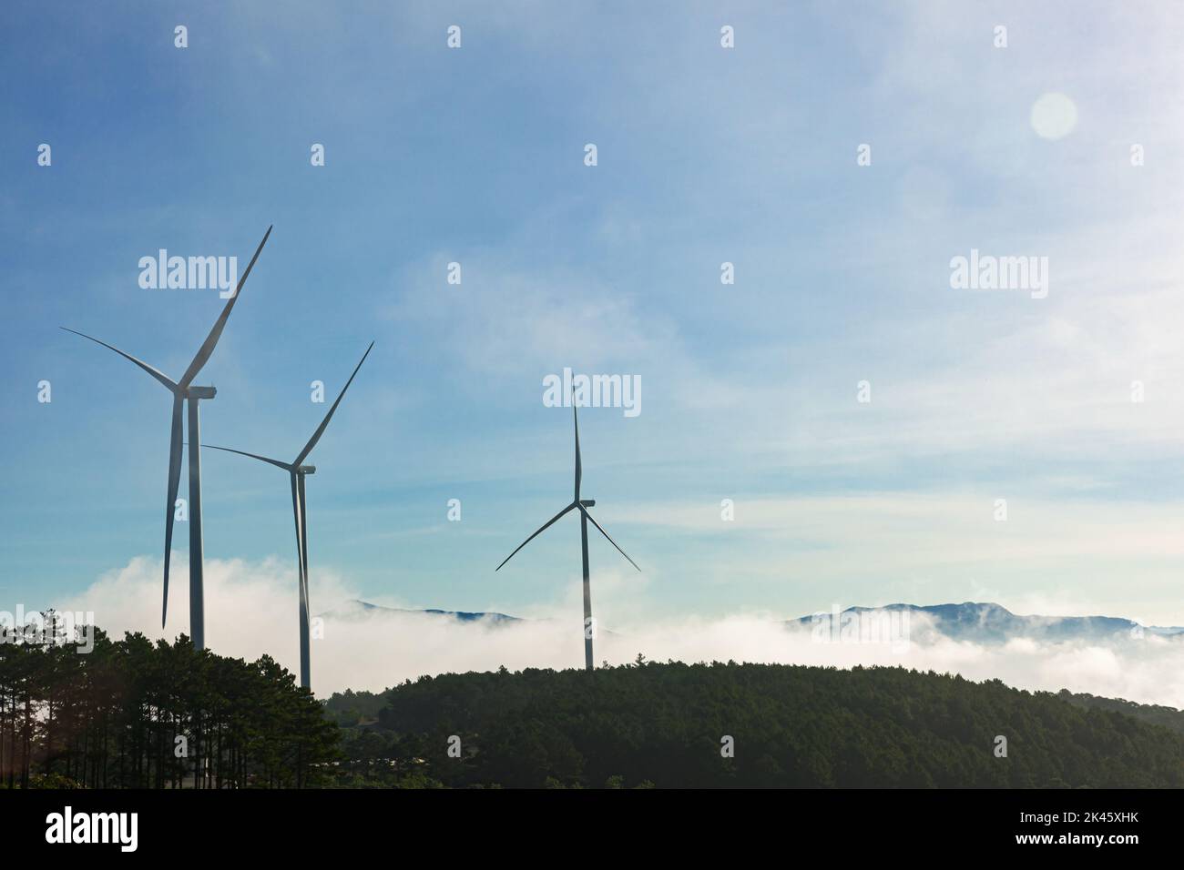Renewable energy wind turbines windmill isolated on the beautiful blue ...