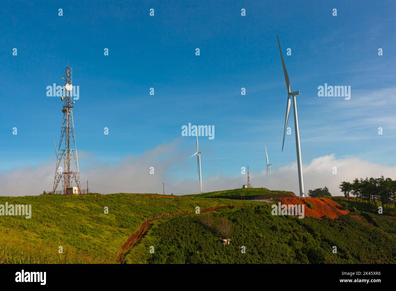 Renewable energy wind turbines windmill isolated on the beautiful blue ...
