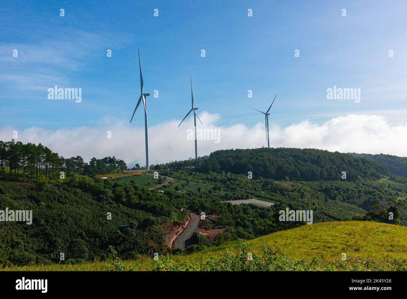 Renewable energy wind turbines windmill isolated on the beautiful blue ...