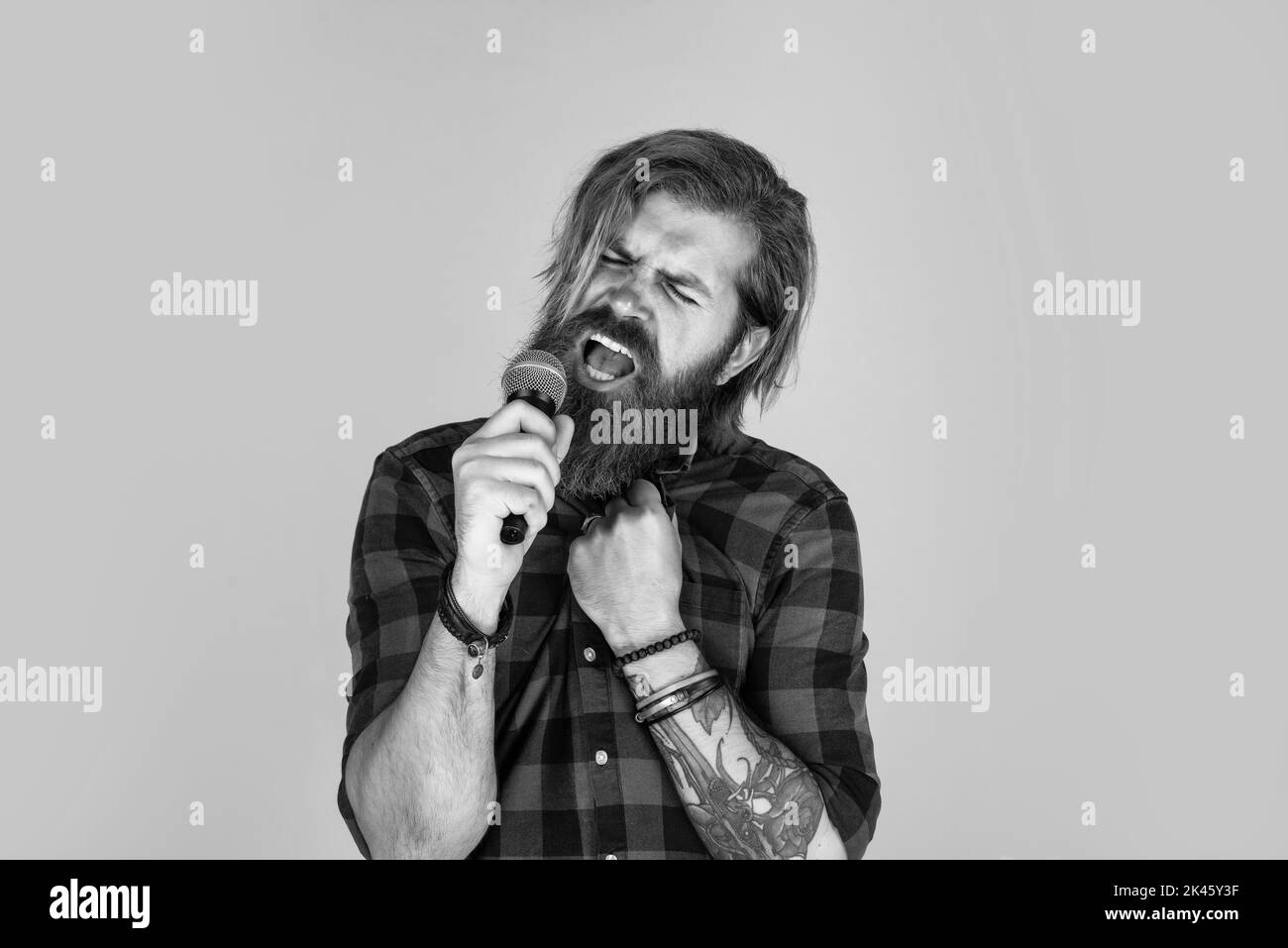 Bearded man singing in Black and White Stock Photos & Images - Alamy