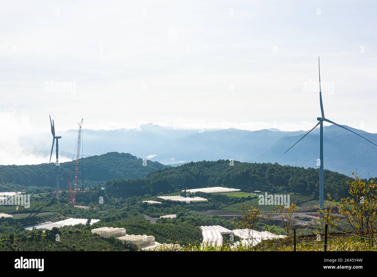 Renewable energy wind turbines windmill isolated on the beautiful blue ...