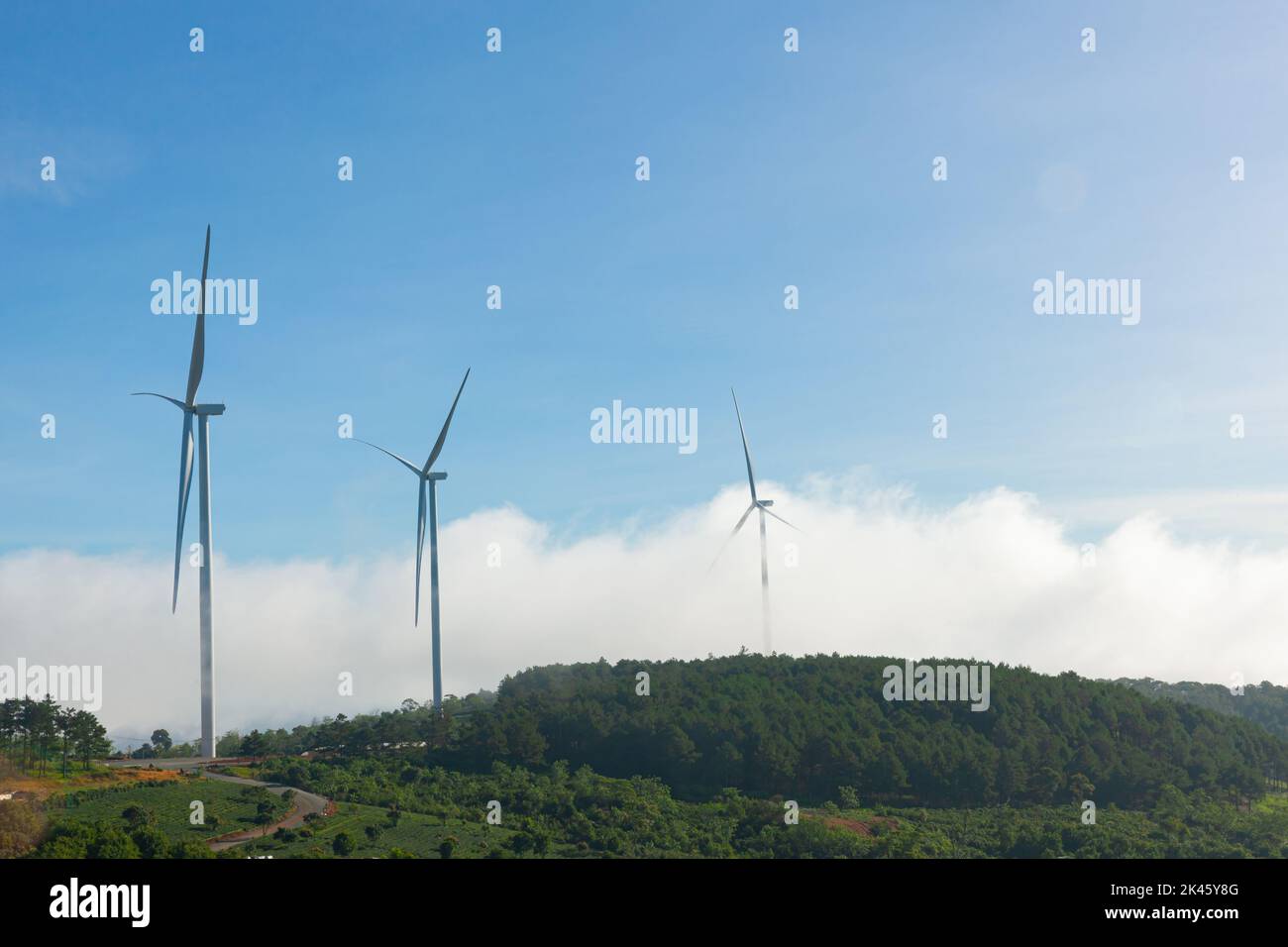 Renewable energy wind turbines windmill isolated on the beautiful blue ...