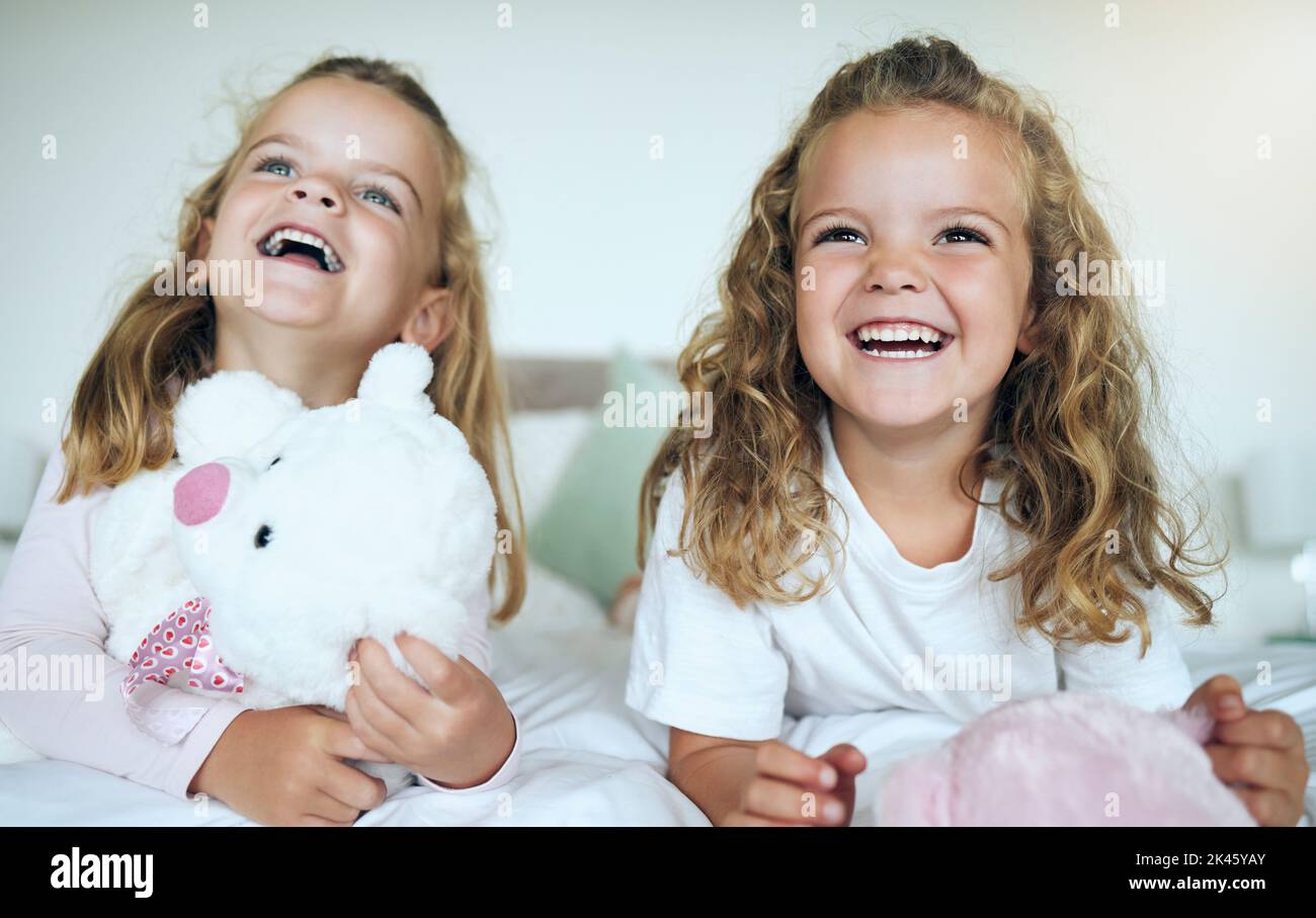 Children, teddy bear and happy sisters playing together in their ...