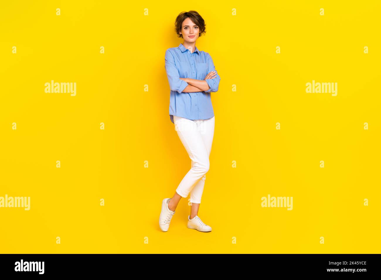Full length photo of adorable good mood girl dressed blue shirt arms ...