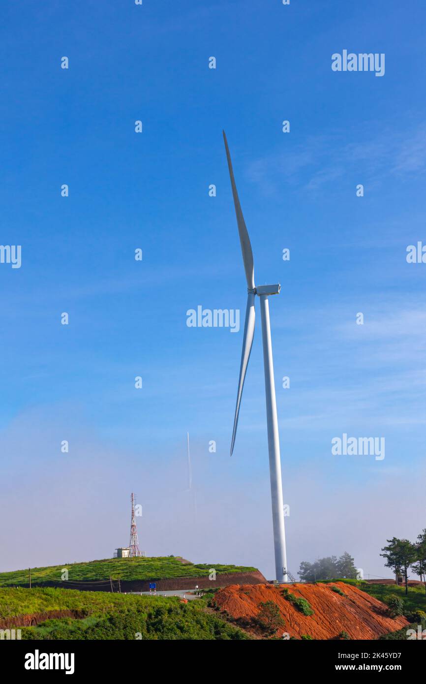 Renewable energy wind turbines windmill isolated on the beautiful blue ...