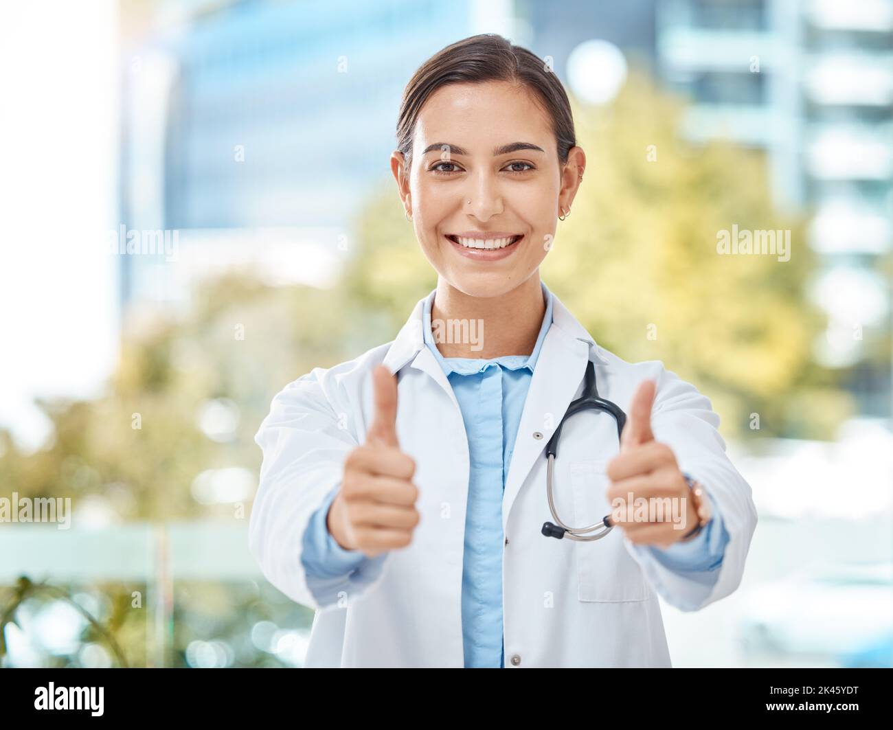 Thumbs up, smile and happy doctor, woman or physician with yes thumbsup ...