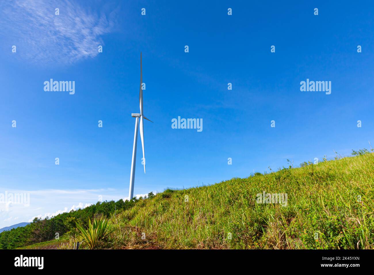 Renewable energy wind turbines windmill isolated on the beautiful blue ...