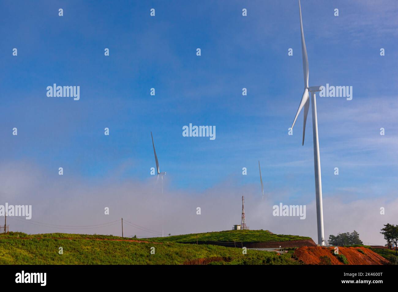 Renewable energy wind turbines windmill isolated on the beautiful blue ...