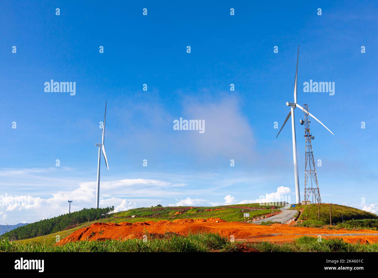 Renewable energy wind turbines windmill isolated on the beautiful blue ...