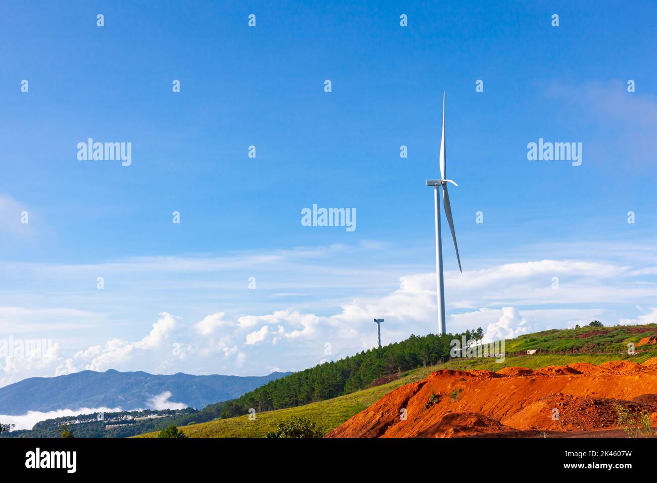 Renewable energy wind turbines windmill isolated on the beautiful blue ...