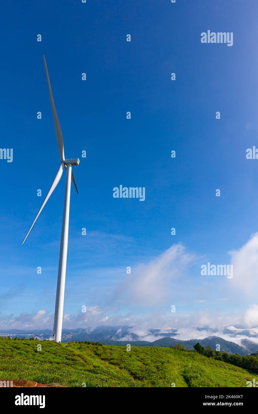 Renewable energy wind turbines windmill isolated on the beautiful blue ...
