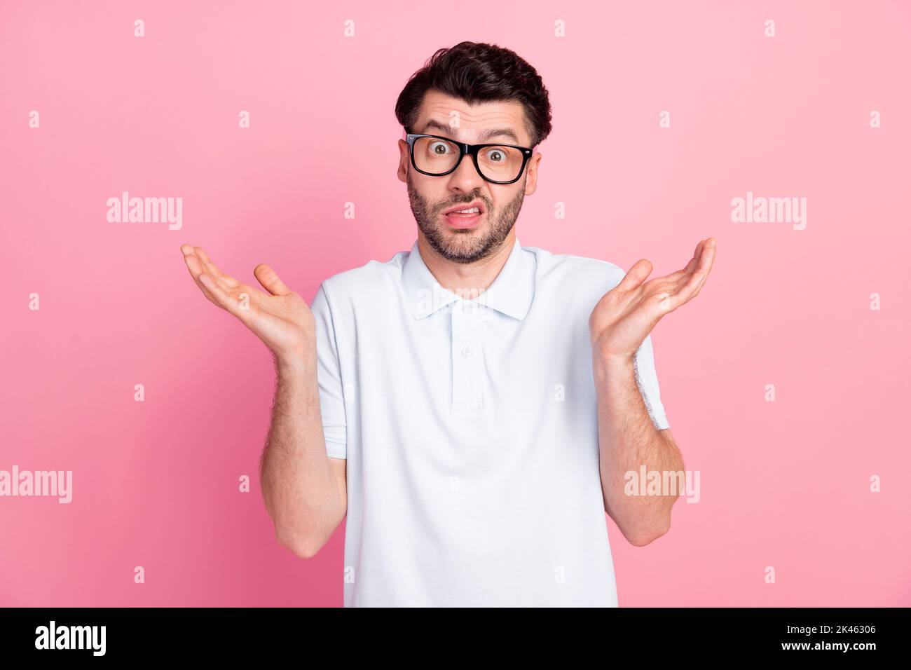 Photo of confused worried man show arm palm cant choose dont understand ...