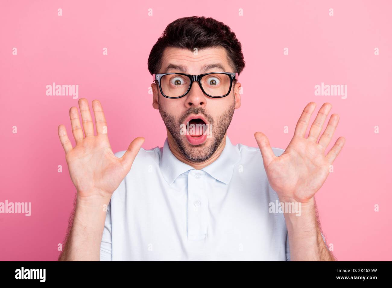 Closeup photo of young funny attractive handsome bearded guy wear eyeglasses palms up ten number ...