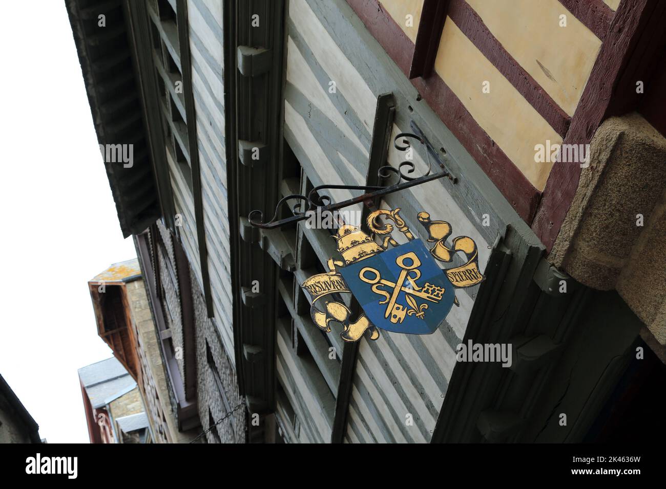 Medieval buildings and restaurant sign on Le Mont Saint Michel ...