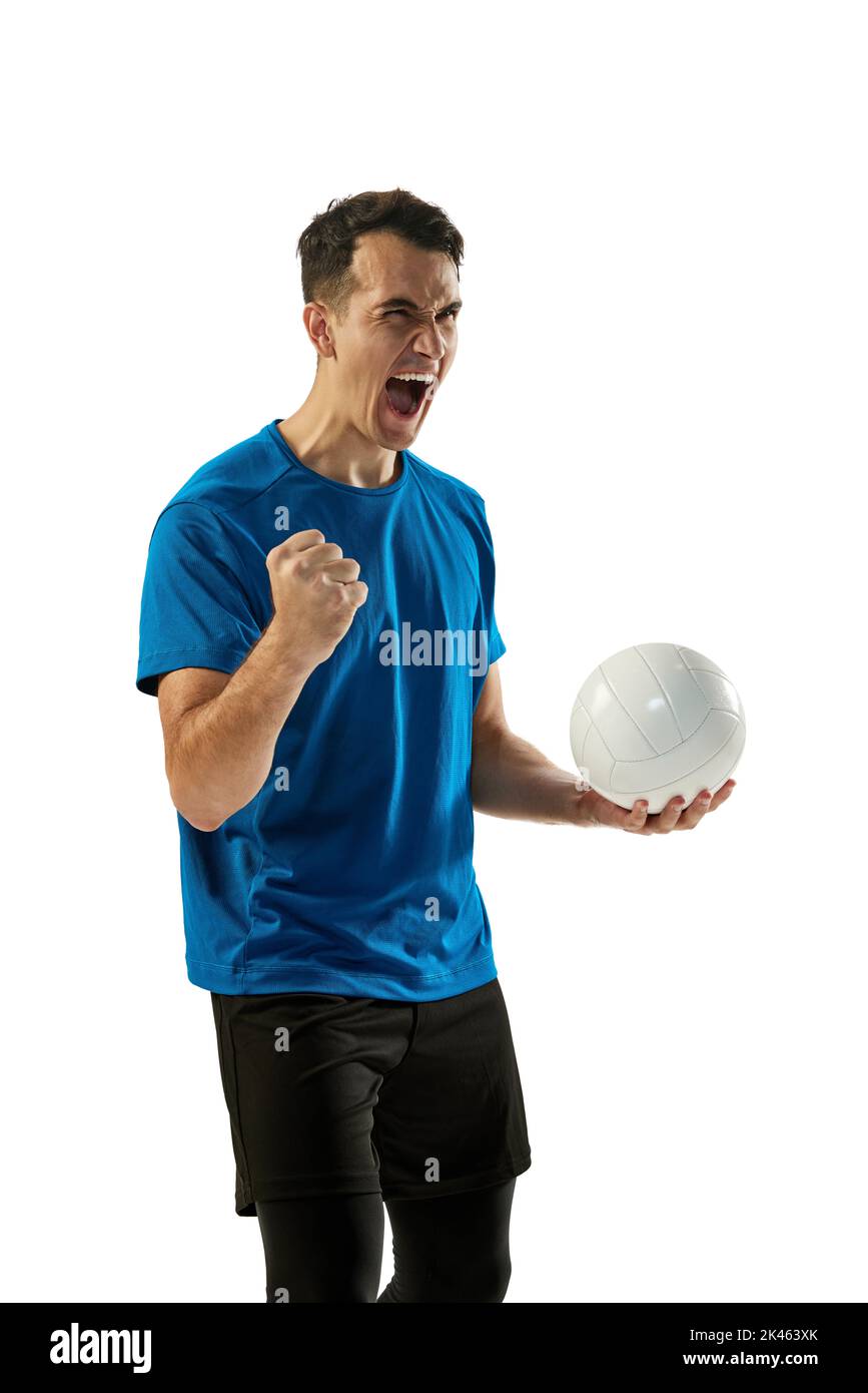 Point. Muscular athlete, male volleyball player shouting with joy ...