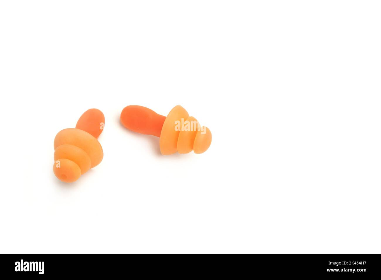 Orange rubber ear plugs on a white background with copy space Stock ...