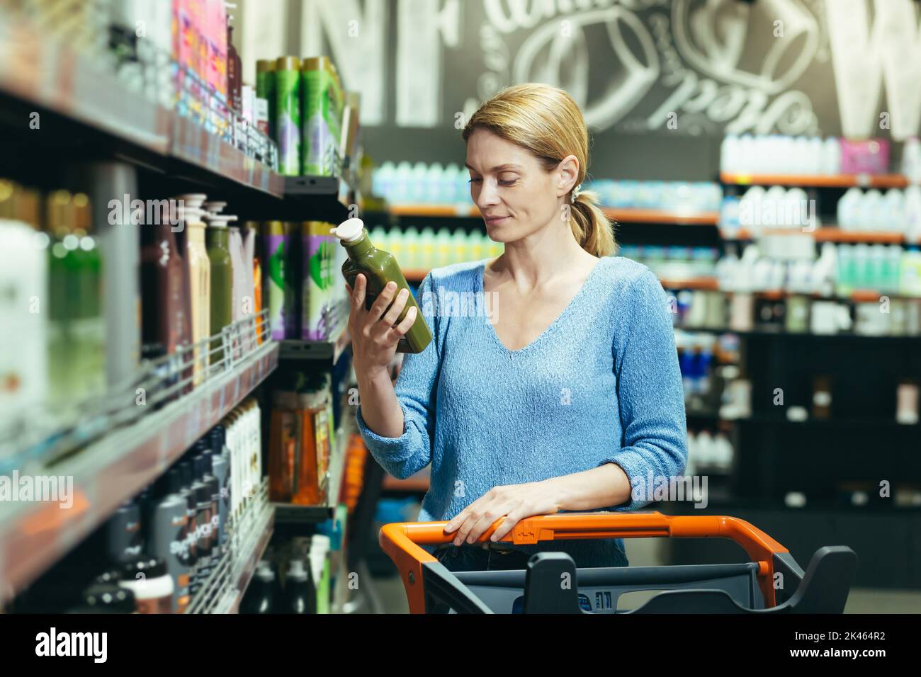 Young female customer reads composition hi-res stock photography and ...