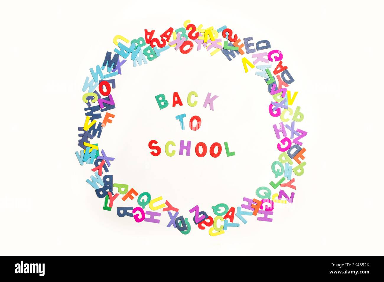 Back to school write with colored toy letters on a white background ...