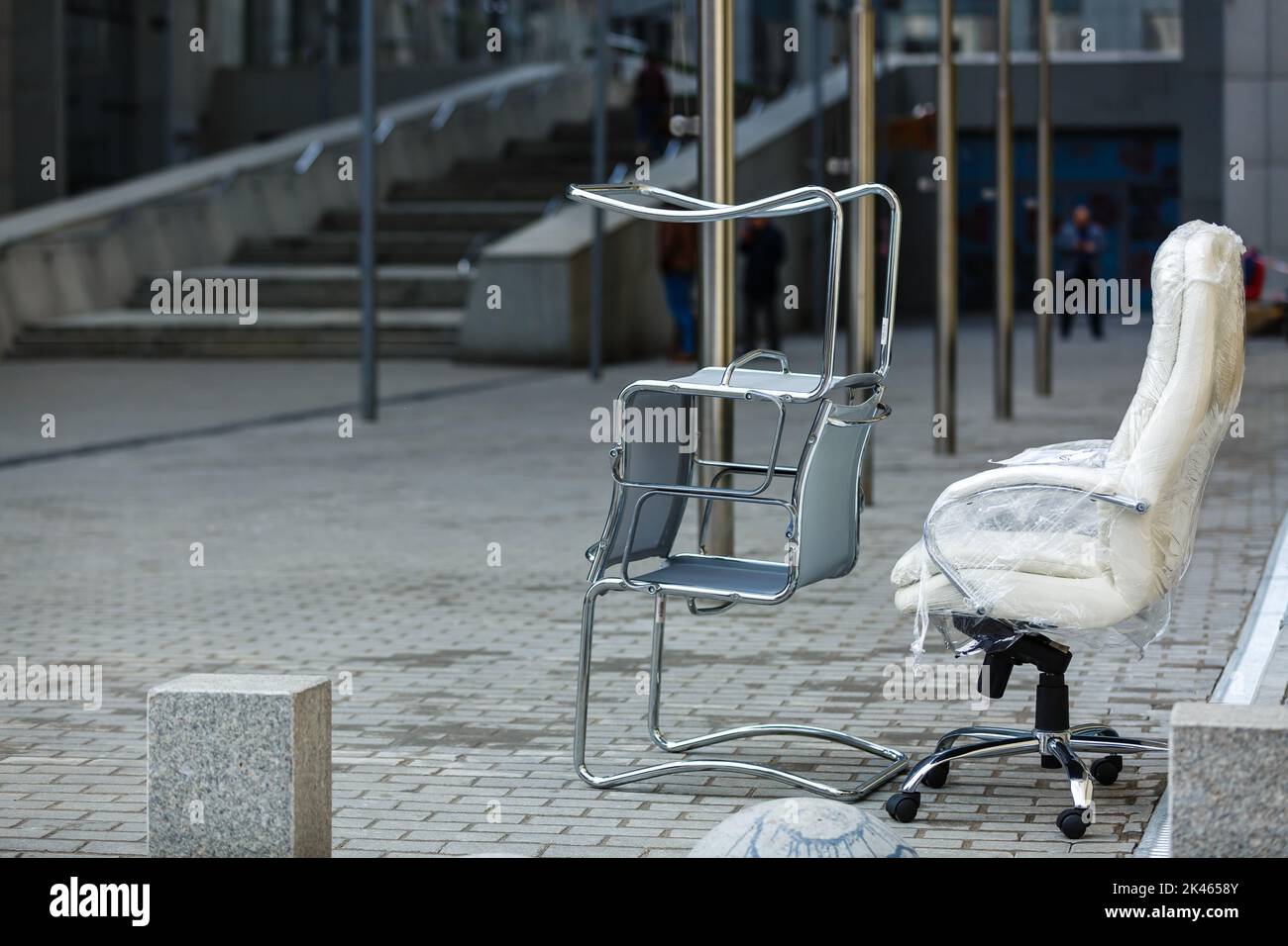 office chairs standing on the pavement Stock Photo - Alamy