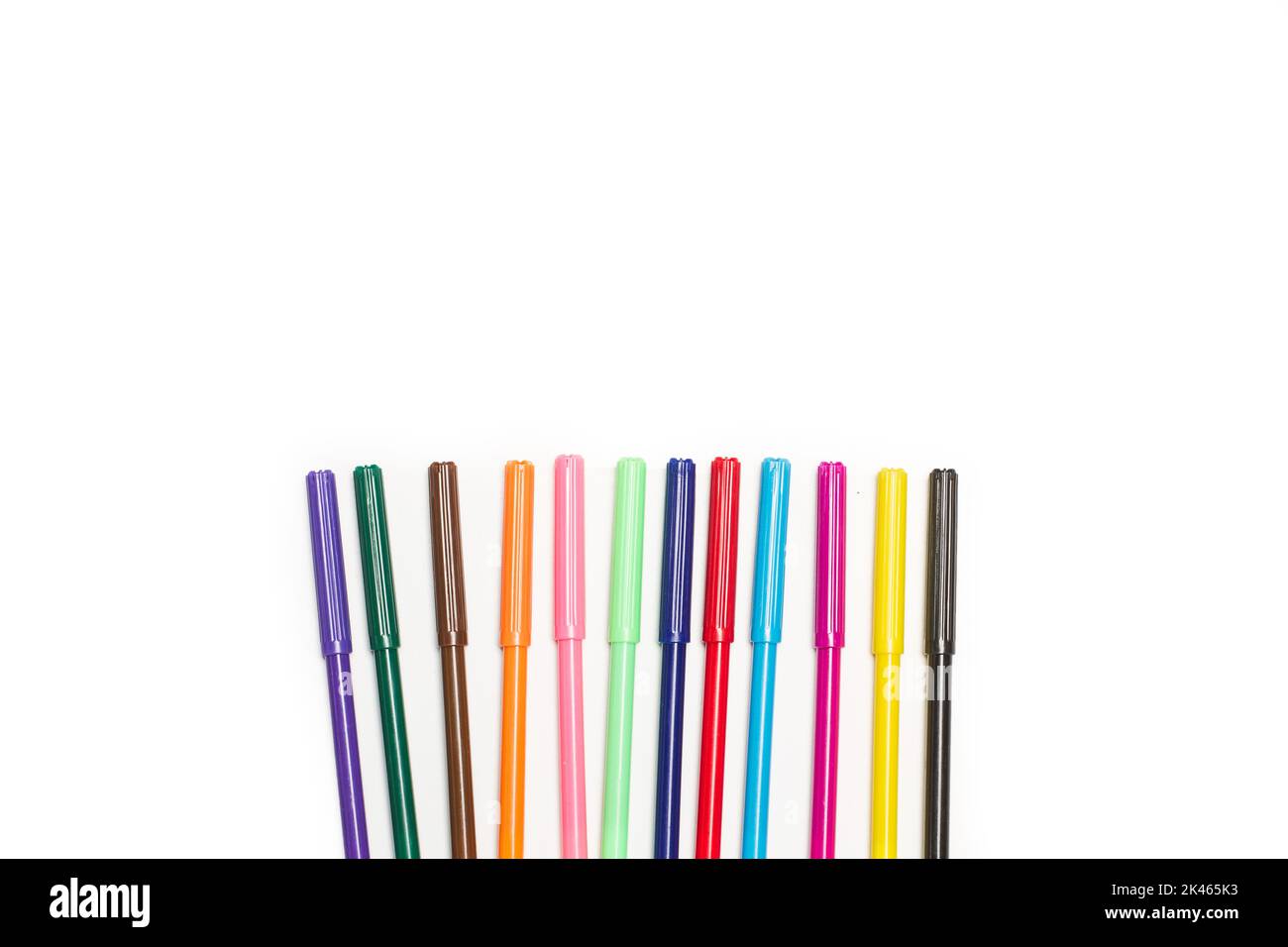 Colored markers on a white background with copy space Stock Photo - Alamy