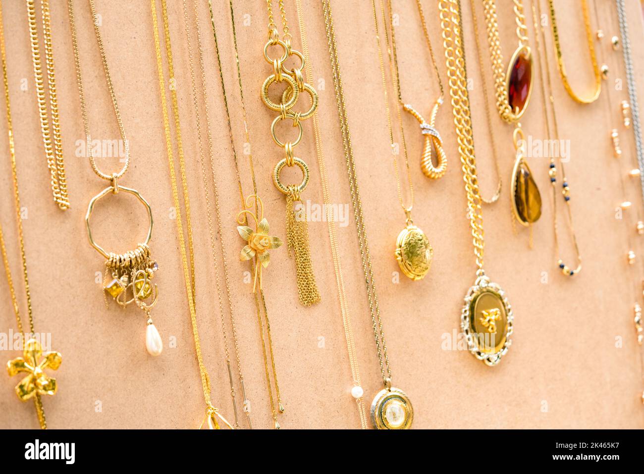 Vintage imitation jewelry background. Old-fashioned necklaces, chains ...