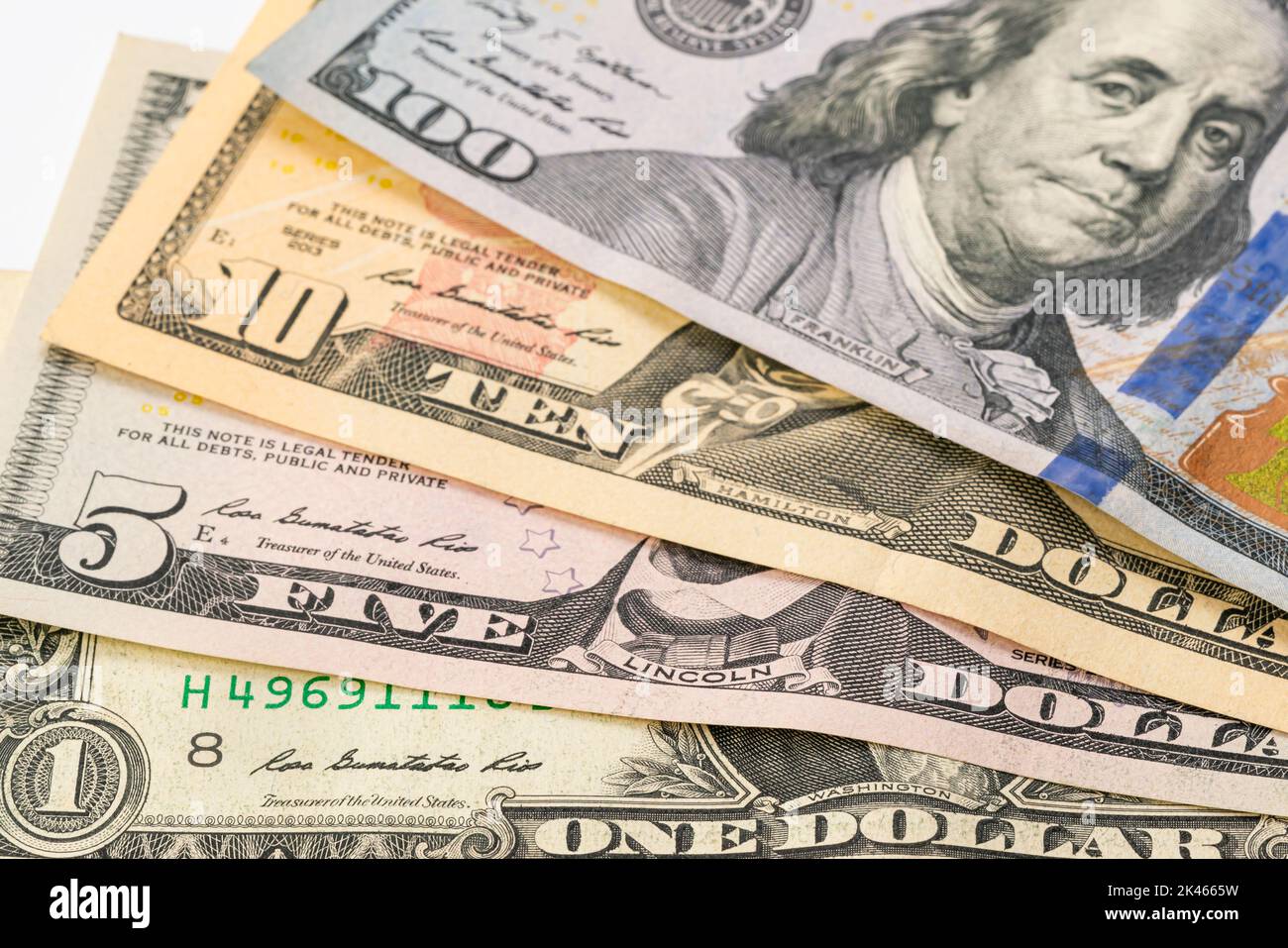 Closeup view pile of one, five, ten and one hundred american dollars ...