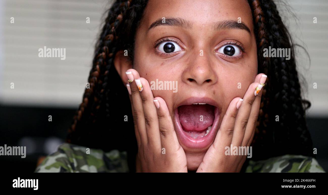 Excited child shocking reaction. girl reacts with surprise with open mouth Stock Photo - Alamy