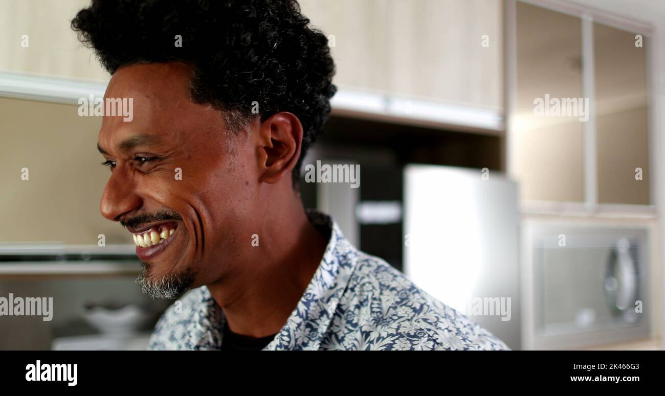 Happy African man grimacing doing funny faces and smiling Stock Photo ...