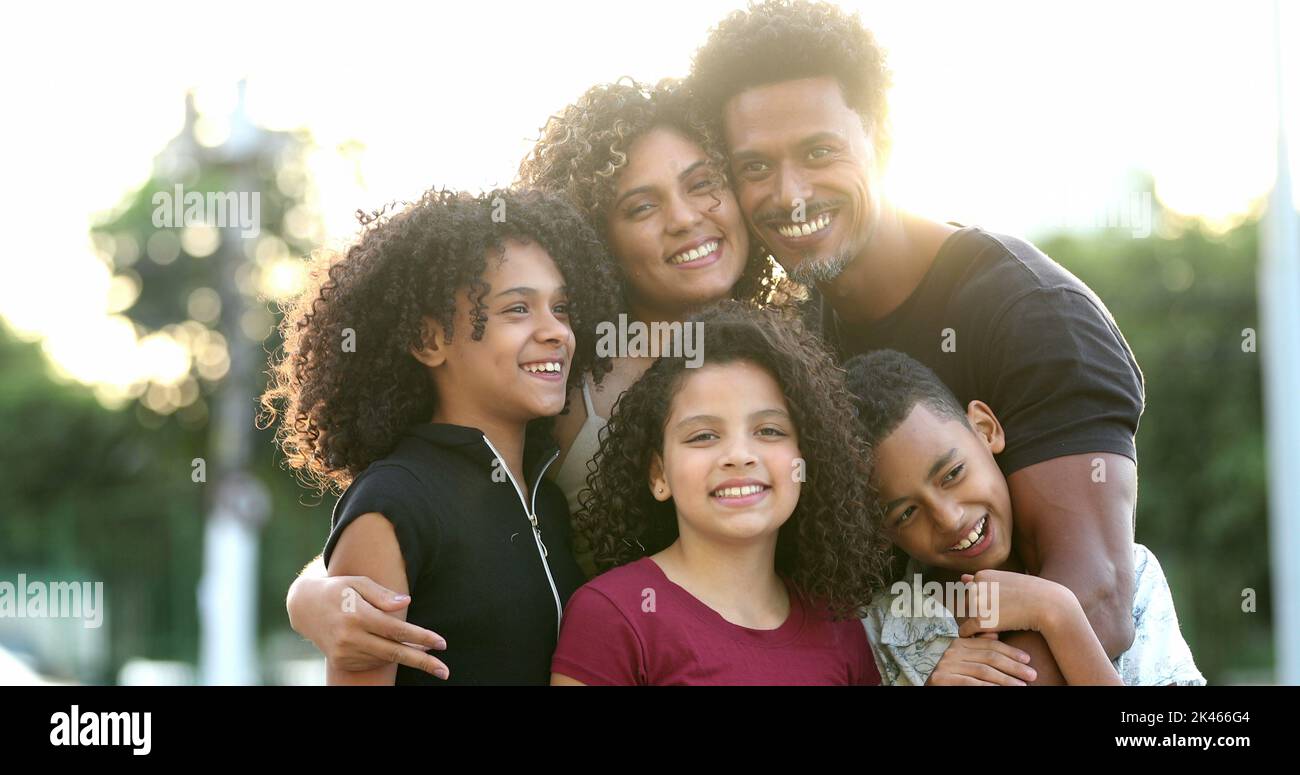 Happy beautiful African Brazilian family outside smiling Stock Photo ...