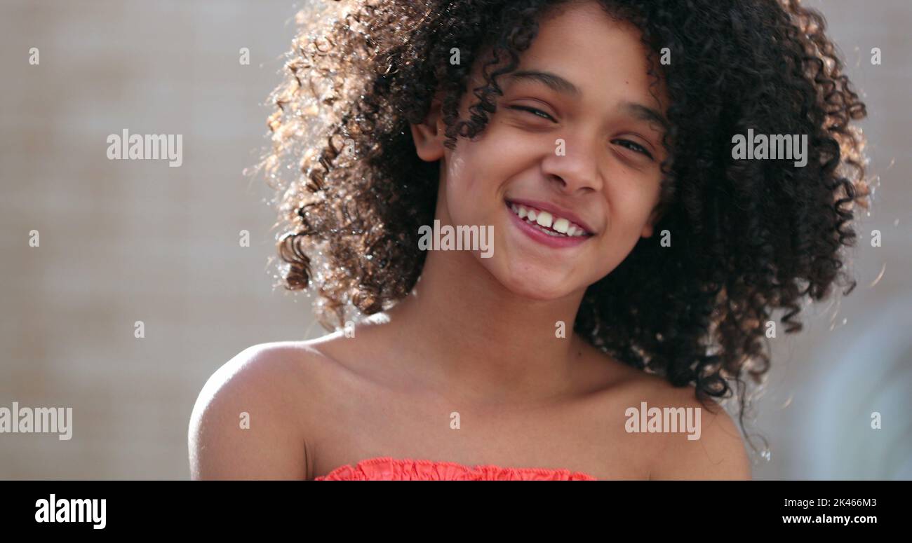 Happy mixed race preteen girl portrait face close-up Stock Photo - Alamy