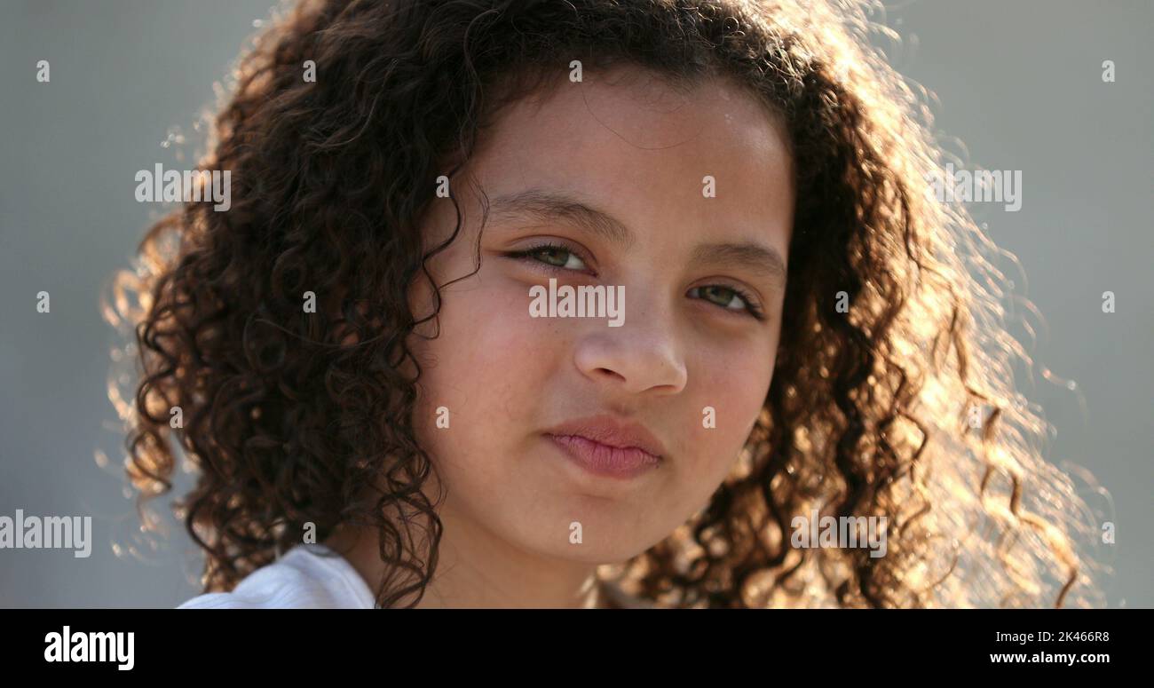 HIspanic little girl child portrait face close-up smiling outside Stock Photo - Alamy