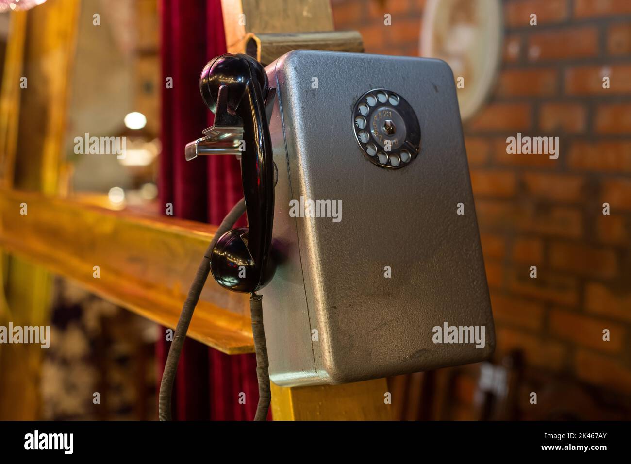 Old soviet telephone with a warning table about the surcharge for a ...