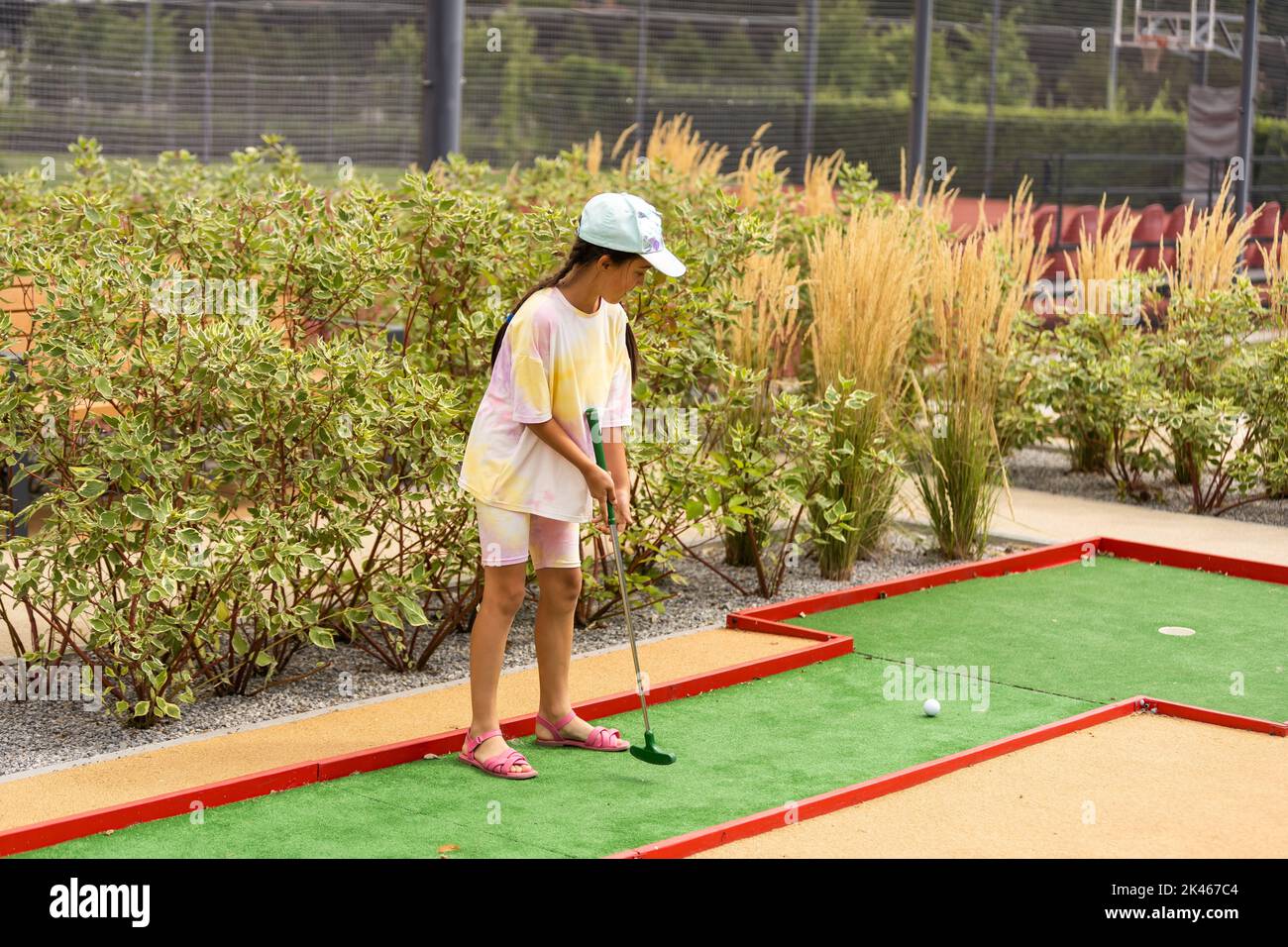 cute little girl on a miniature golf course Stock Photo - Alamy